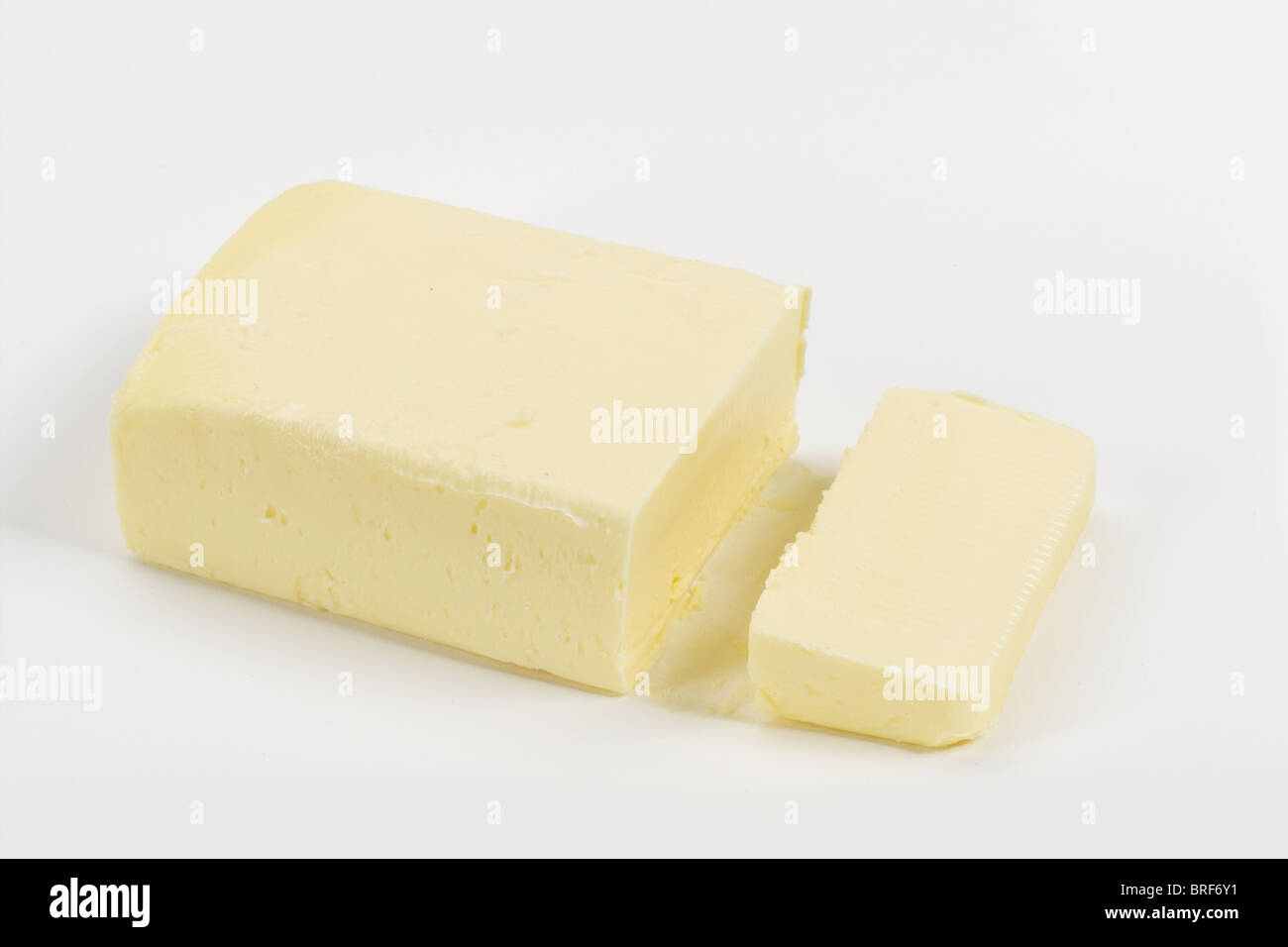 Butter block against white background Stock Photo - Alamy