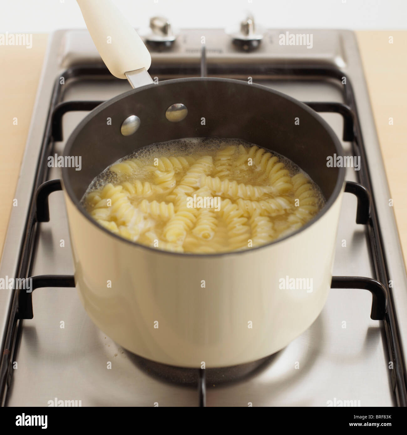 Pan of fusilli pasta boiling, close-up Stock Photo - Alamy