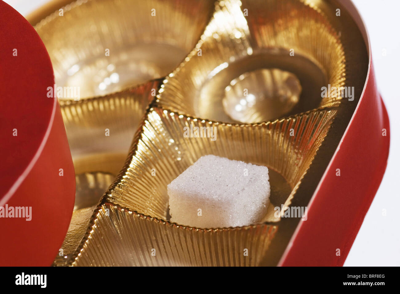 Sugar cube in a chocolate box Stock Photo - Alamy