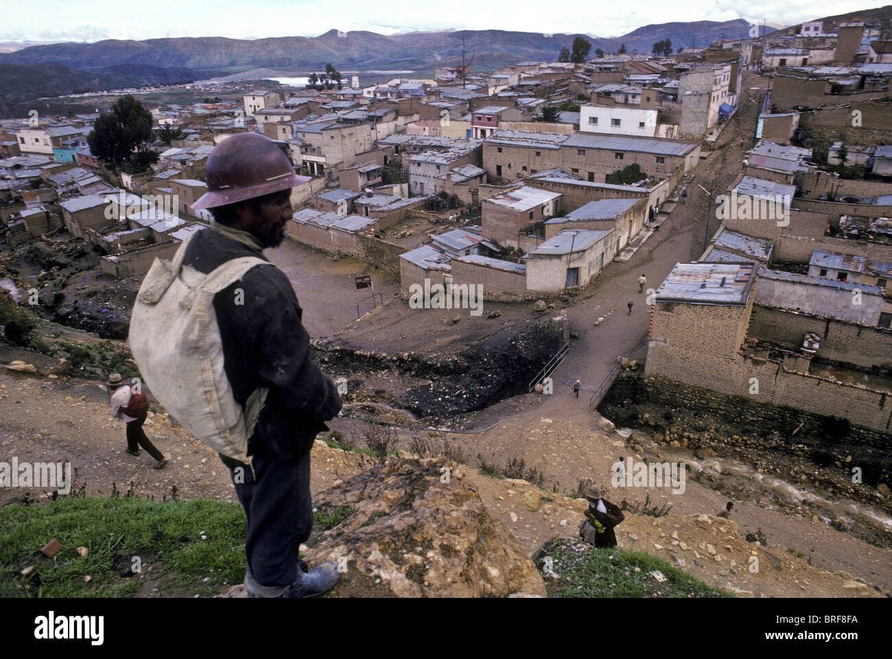 Miner overlooks the town of Siglo XX tin mine, Llallagua, Bolivia Stock ...