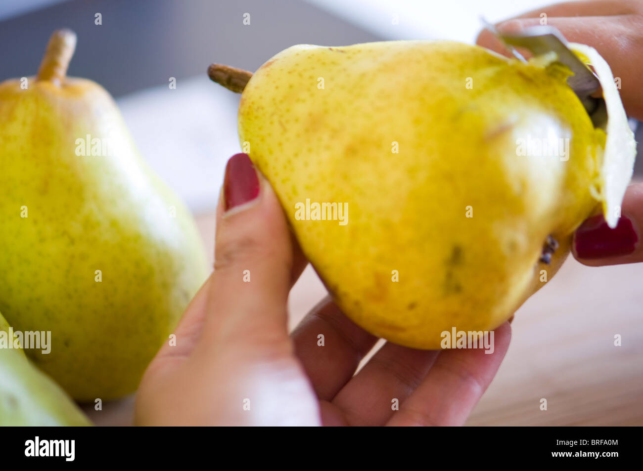 Peeling the pear Stock Photo - Alamy
