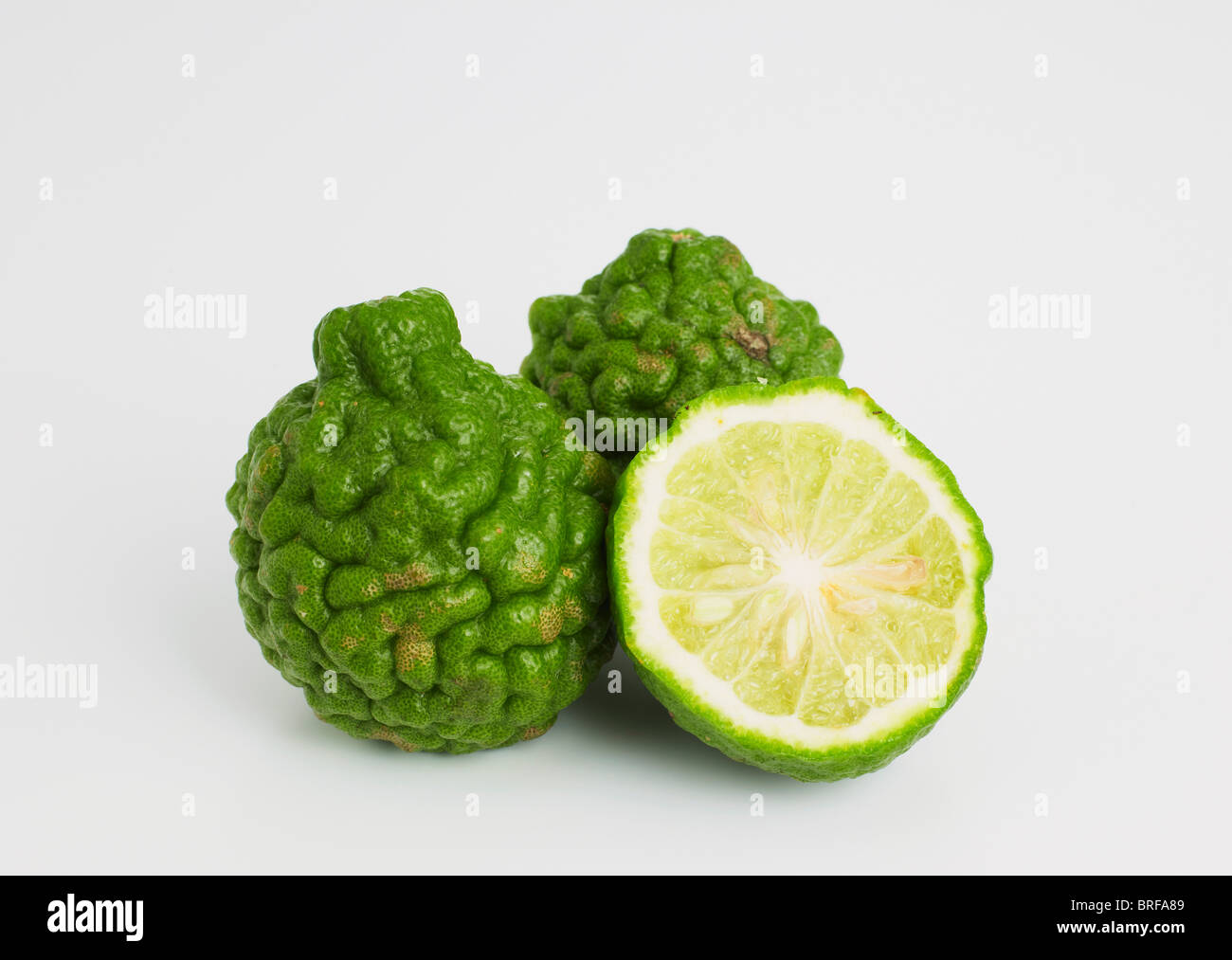 Kaffir limes on white background Stock Photo - Alamy