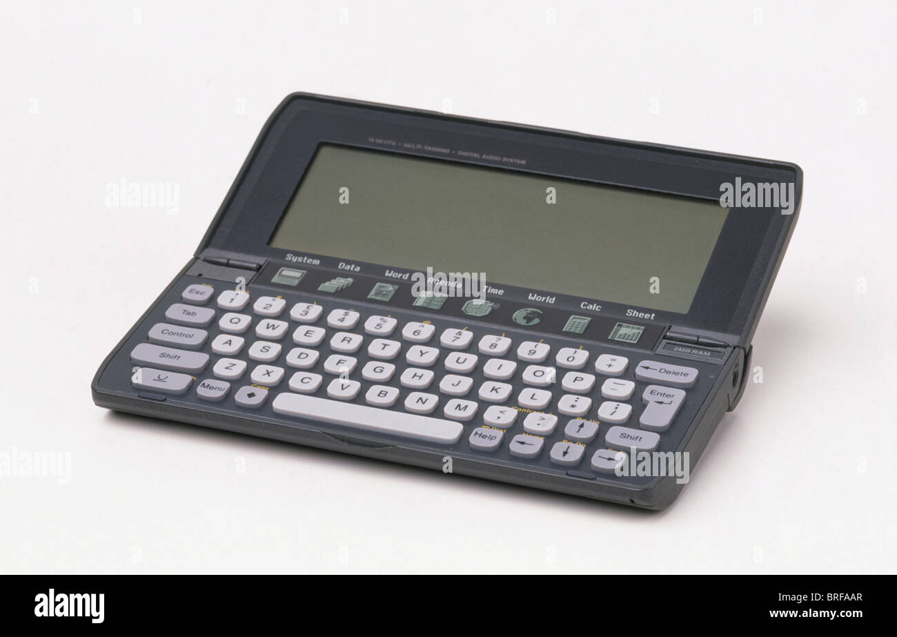 Calculator against white background Stock Photo - Alamy