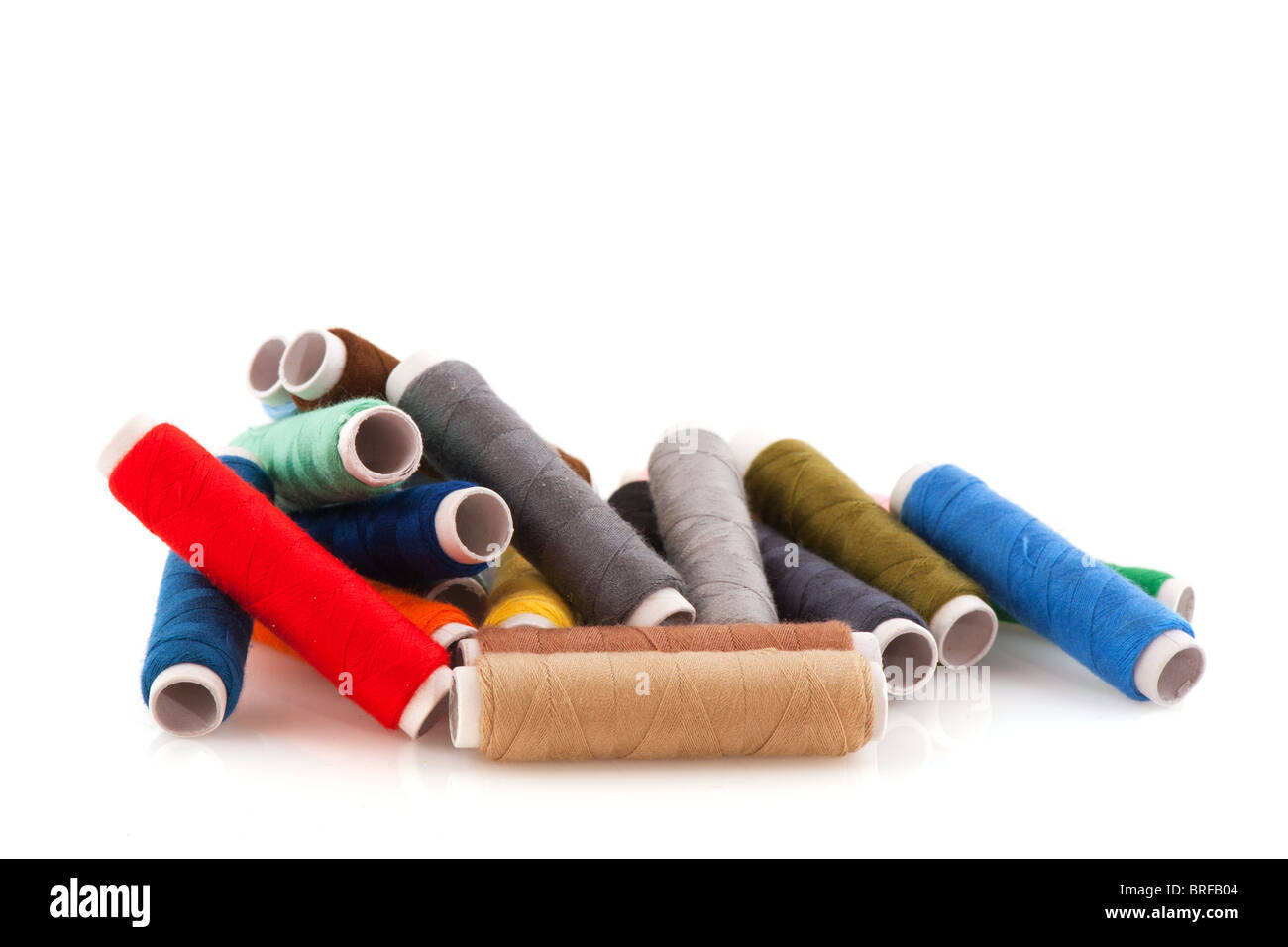 colorful threads on spools Stock Photo - Alamy