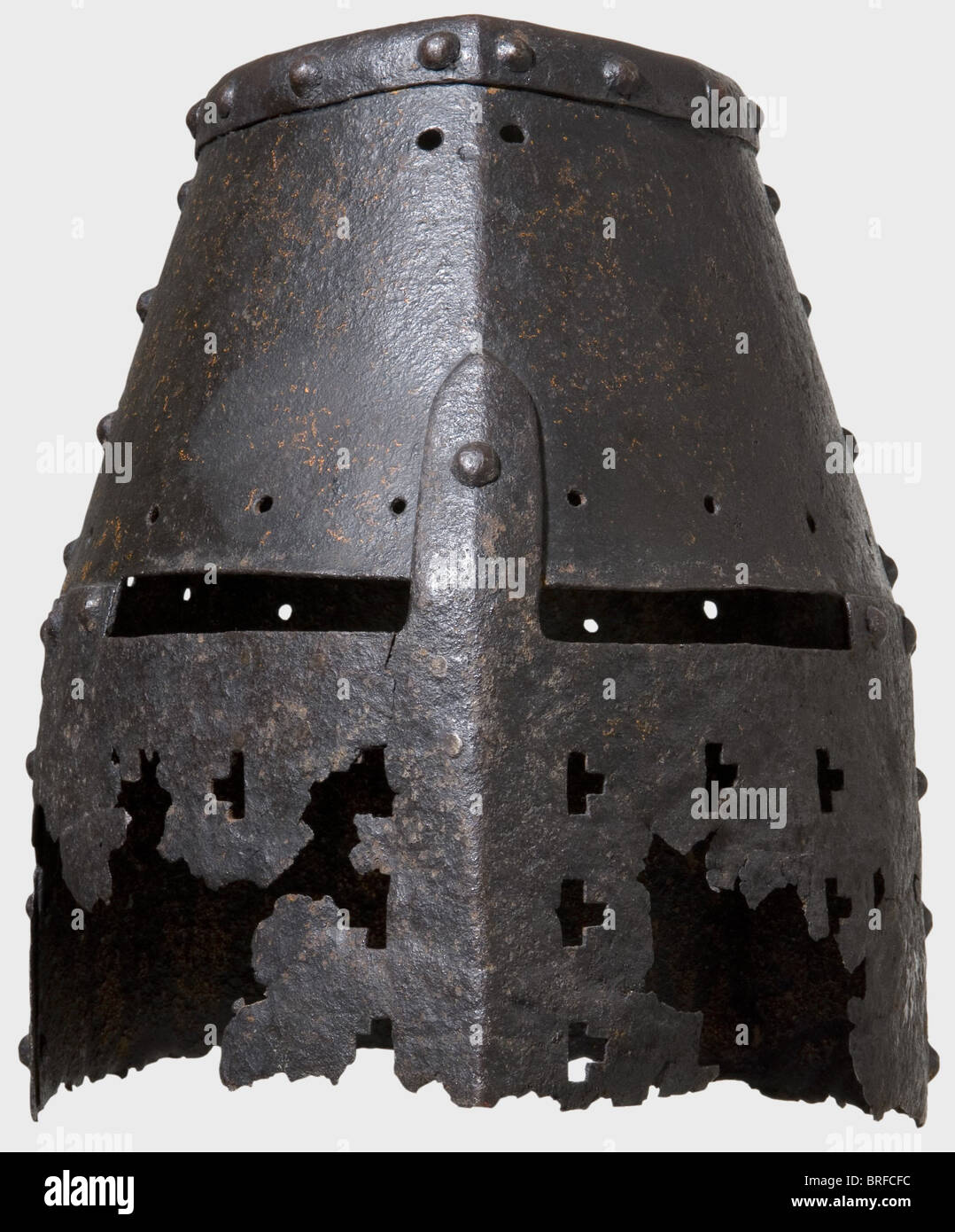 A pot helmet, German in the style of circa 1300, with 19th century work ...