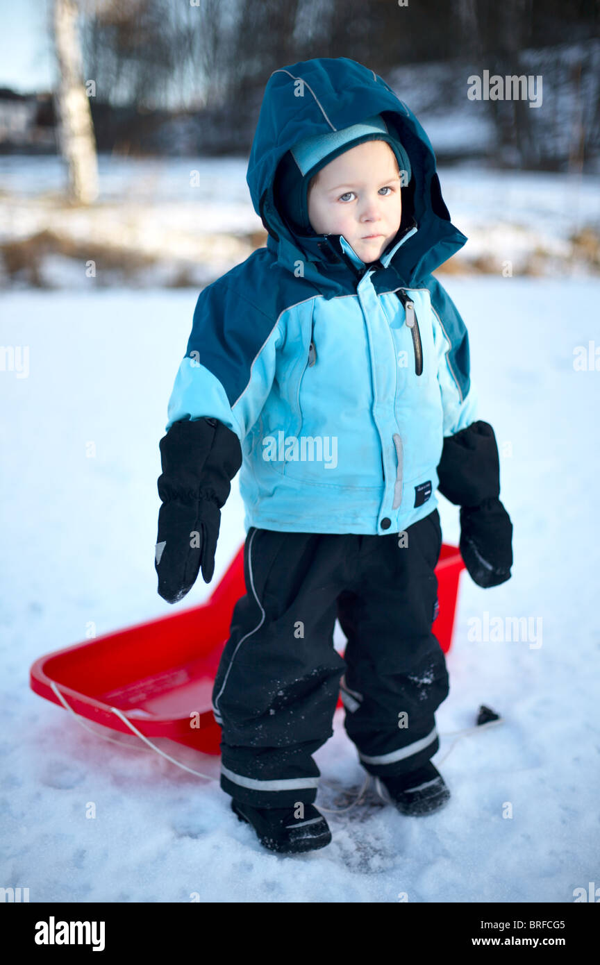 Boy with sledge Stock Photo - Alamy