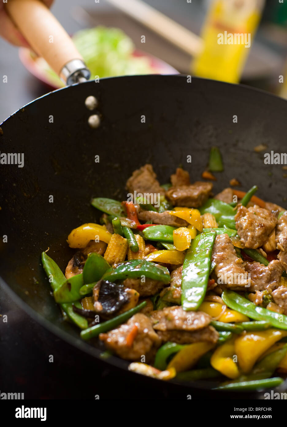 Chef cooking wok Stock Photo - Alamy