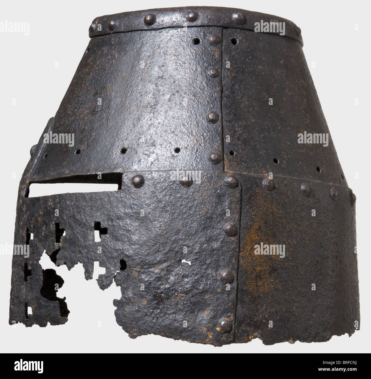 A pot helmet, German in the style of circa 1300, with 19th century work ...