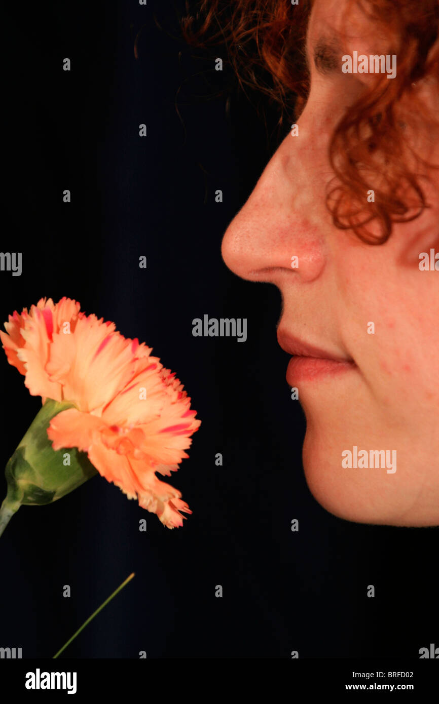 Woman with a carnation Stock Photo - Alamy