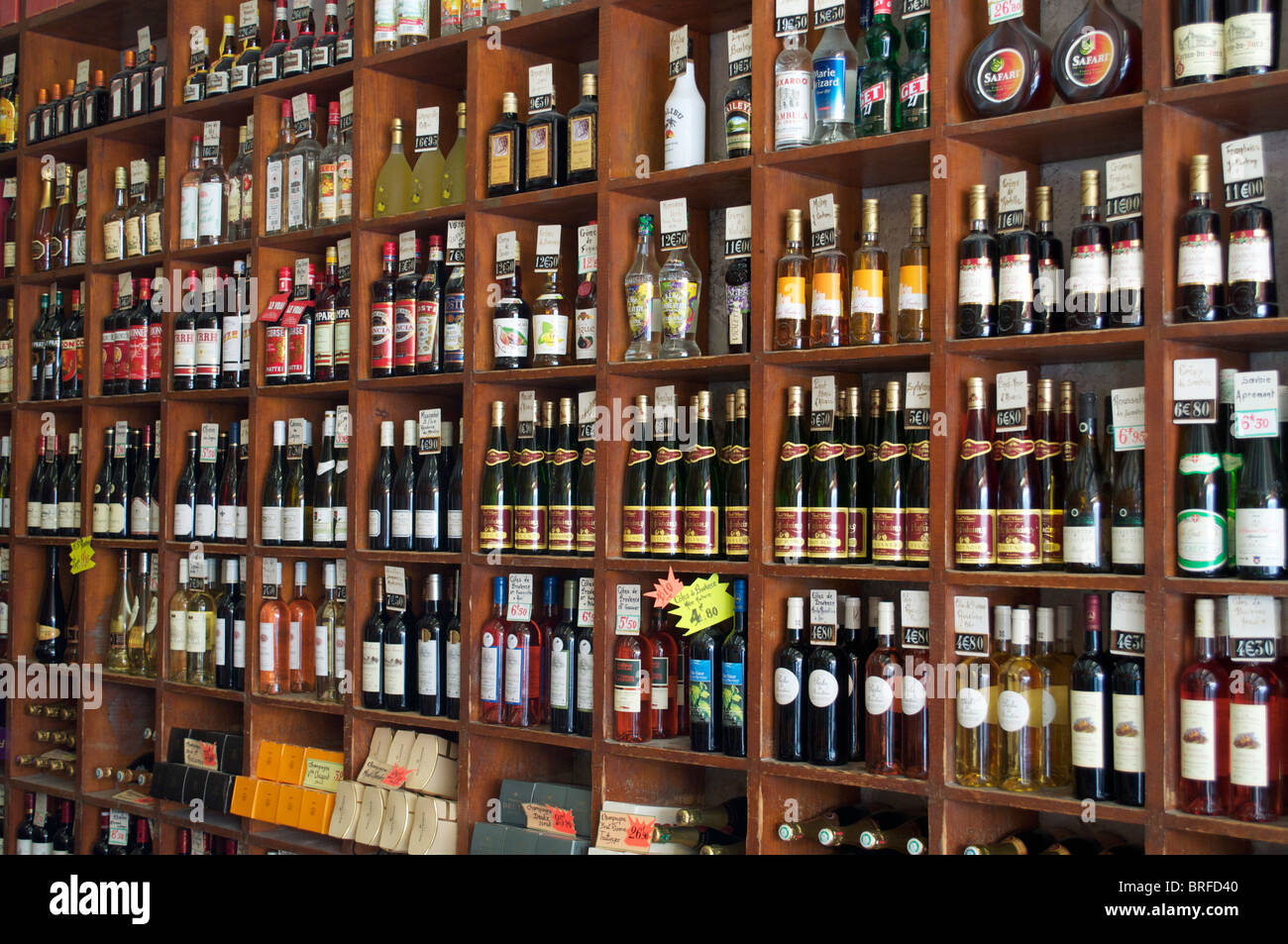 Selection of alcoholic beverages on display at an off license in France ...