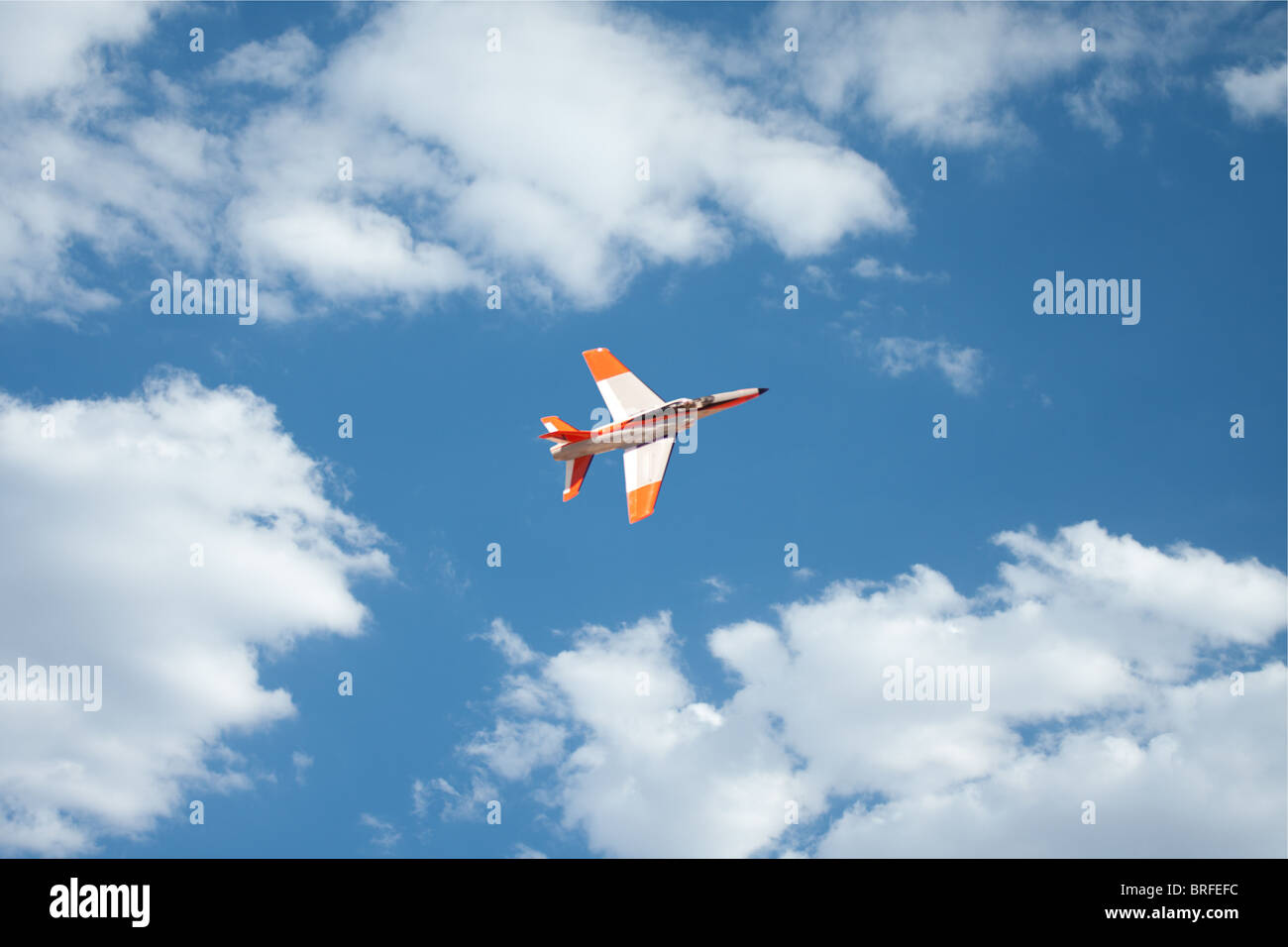 RC remote controlled Real Jet airplane model in action on blue sky ...