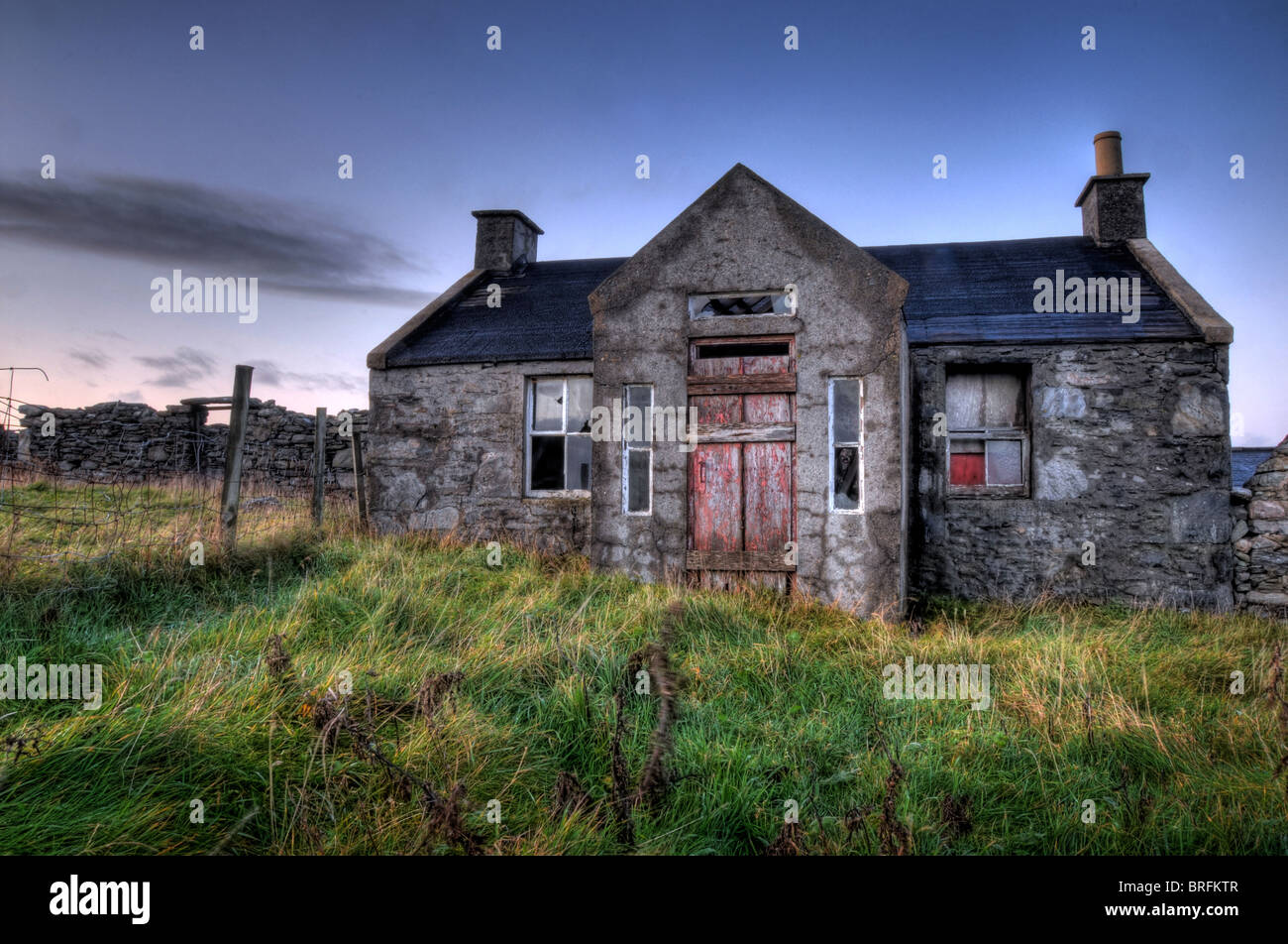Old abandoned croft house with red door Stock Photo - Alamy