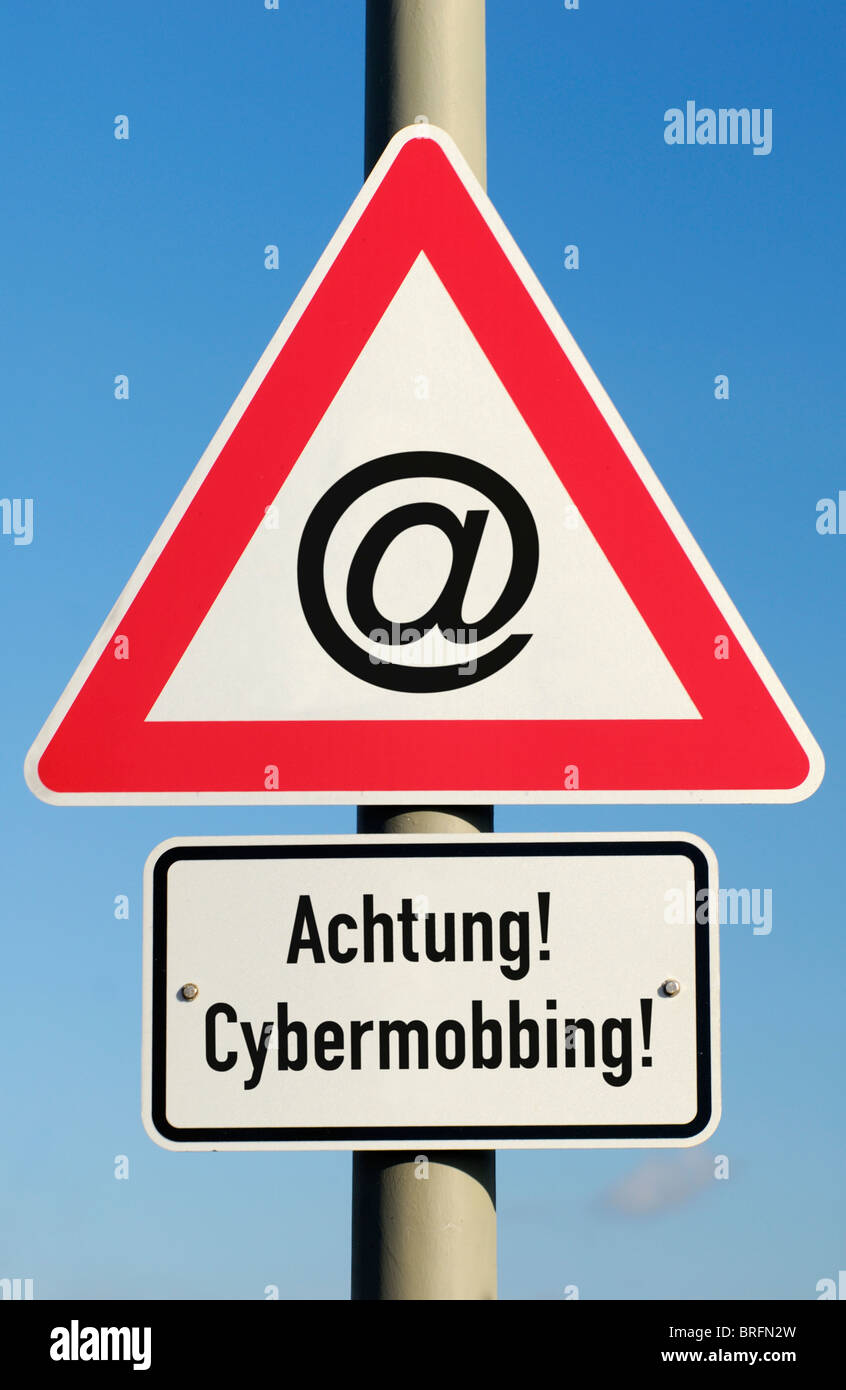 Warning sign cyberbullying (montage Stock Photo - Alamy