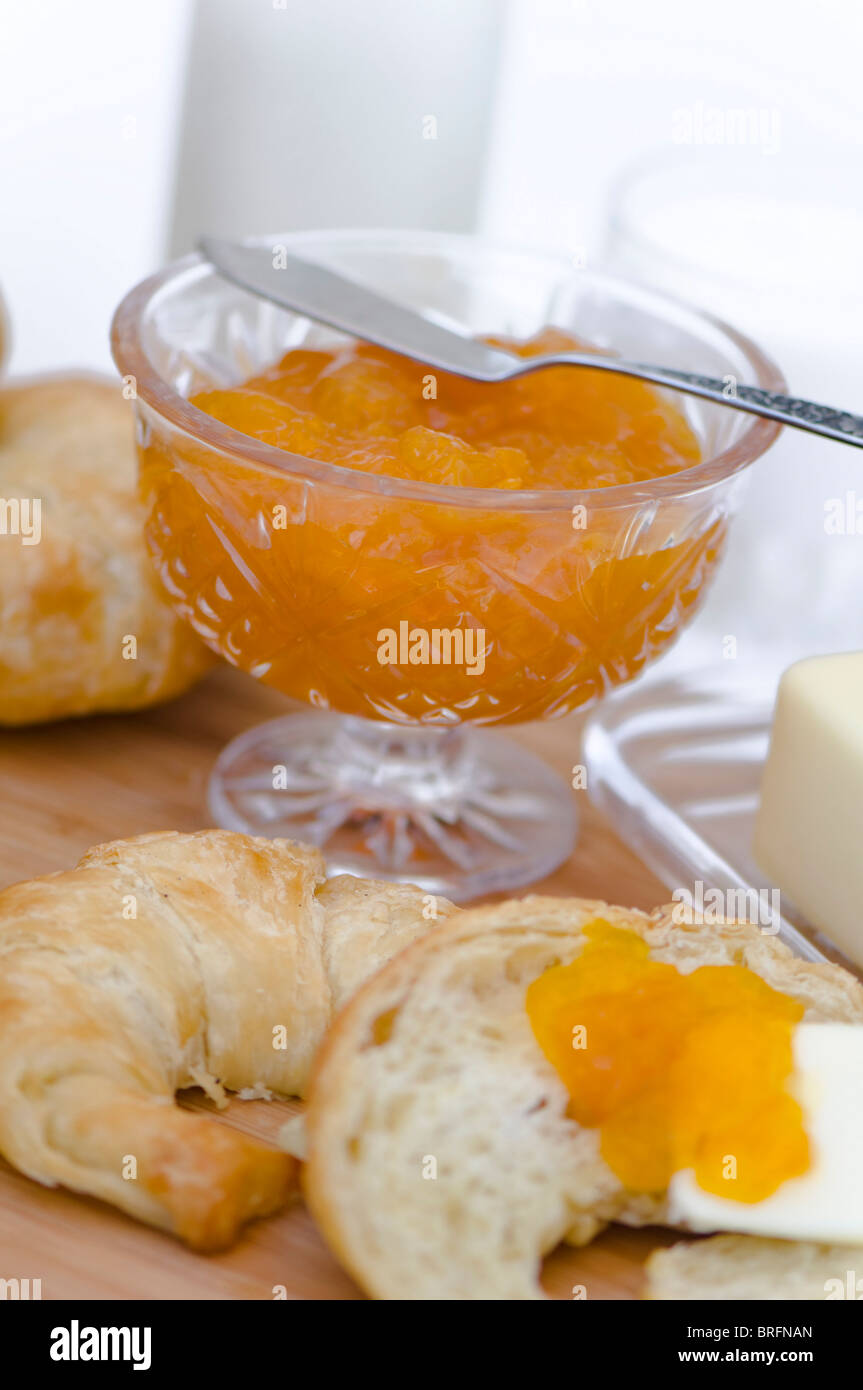 Breakfast with croissant, Camembert cheese, milk, and apricot jam Stock ...