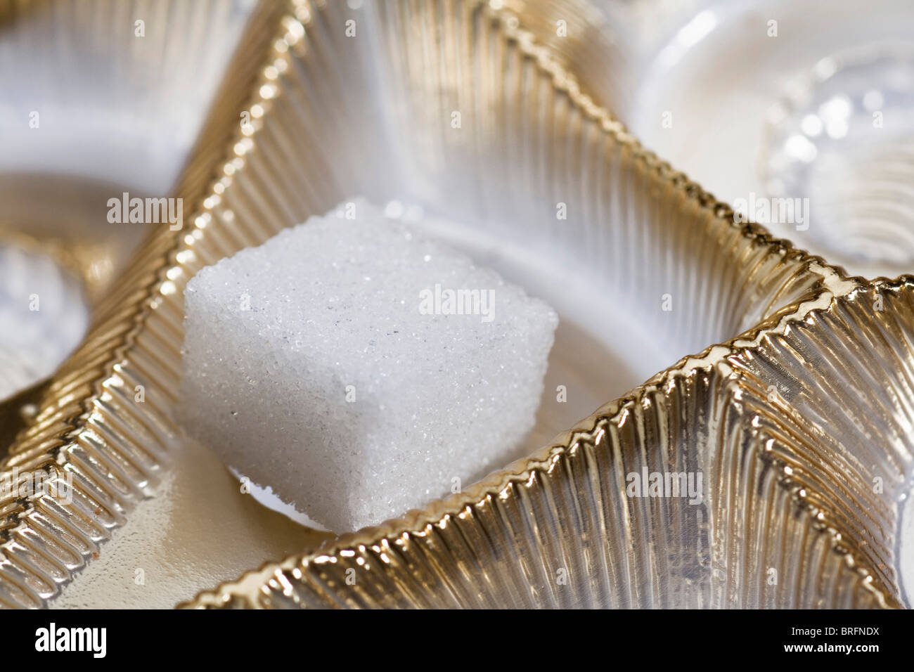 Sugar cube in a chocolate box Stock Photo - Alamy