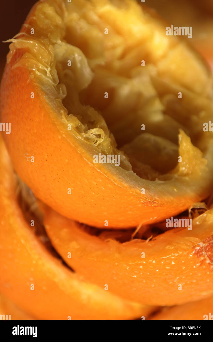 Pressed out orange bowls Stock Photo - Alamy
