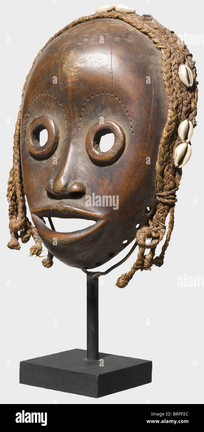 A Dan mask,Ivory Coast,1st half of the 19th century. Wooden mask with ...