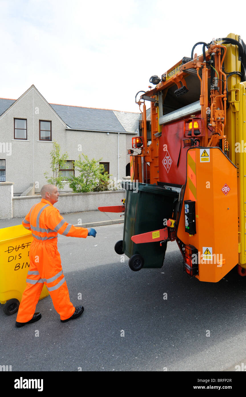 Dustmen collecting rubbish with wheelie bins Stock Photo - Alamy