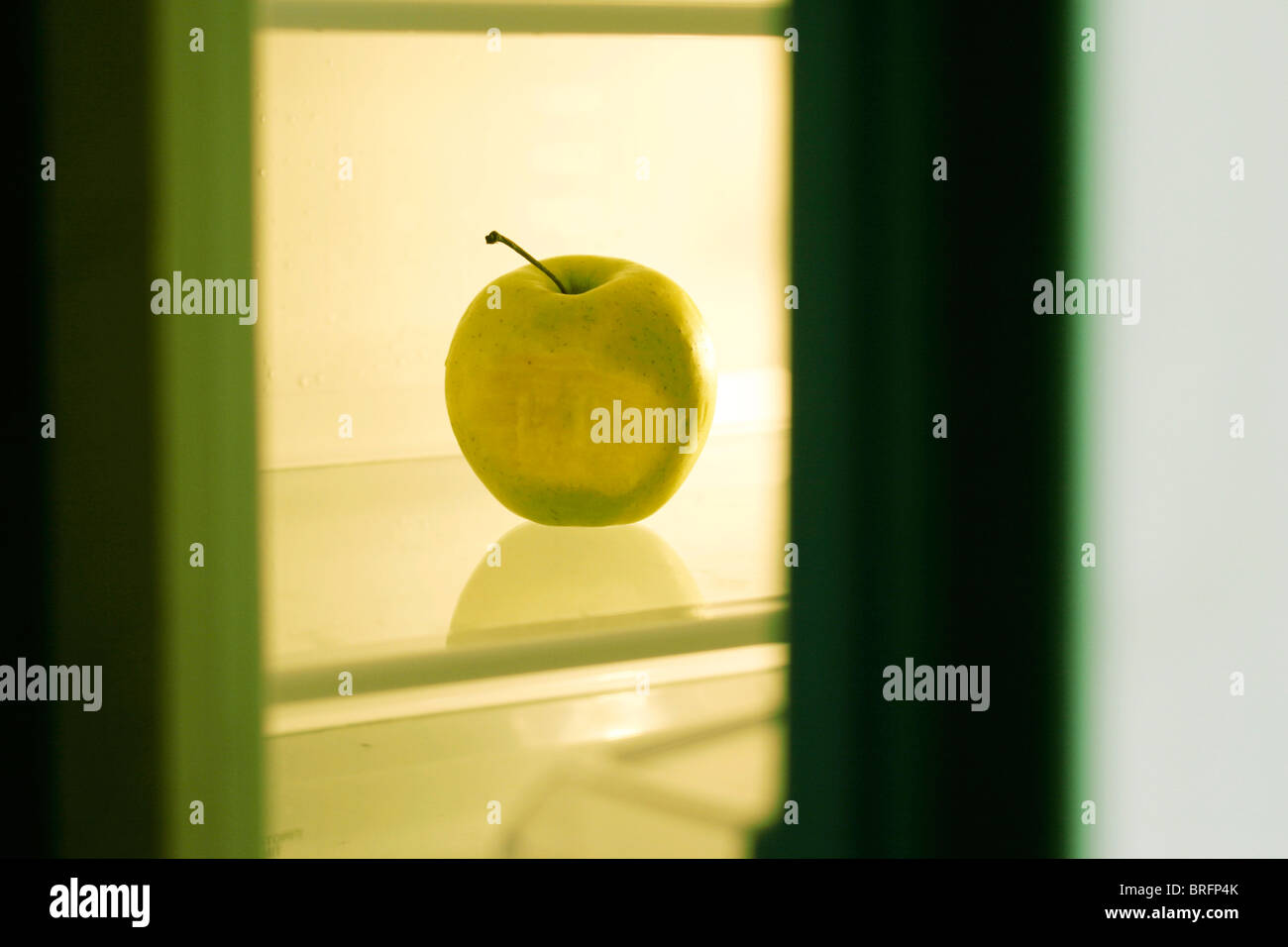 Apple in a refrigerator Stock Photo - Alamy