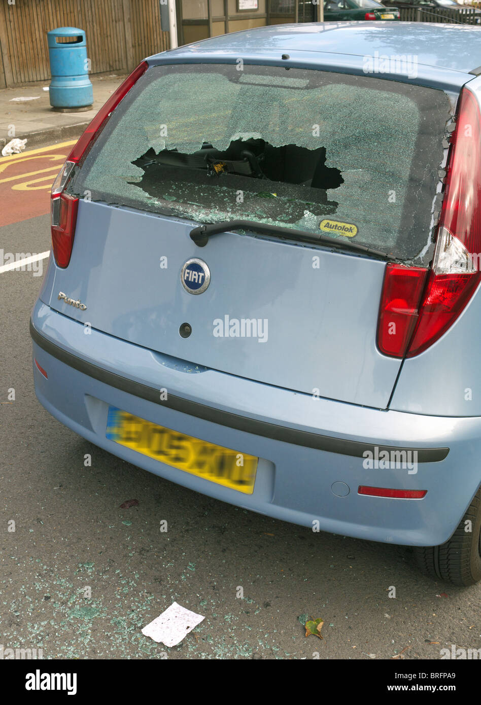 A vandalised Fiat car with a smashed back window Stock Photo - Alamy