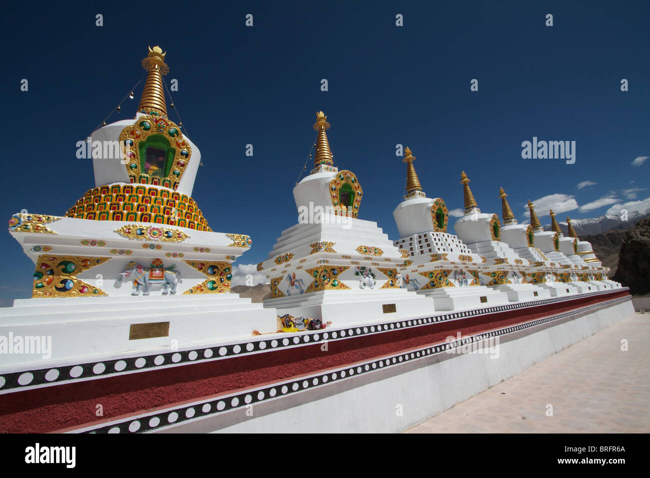 line of white chortens in the thiksey gompa Stock Photo - Alamy