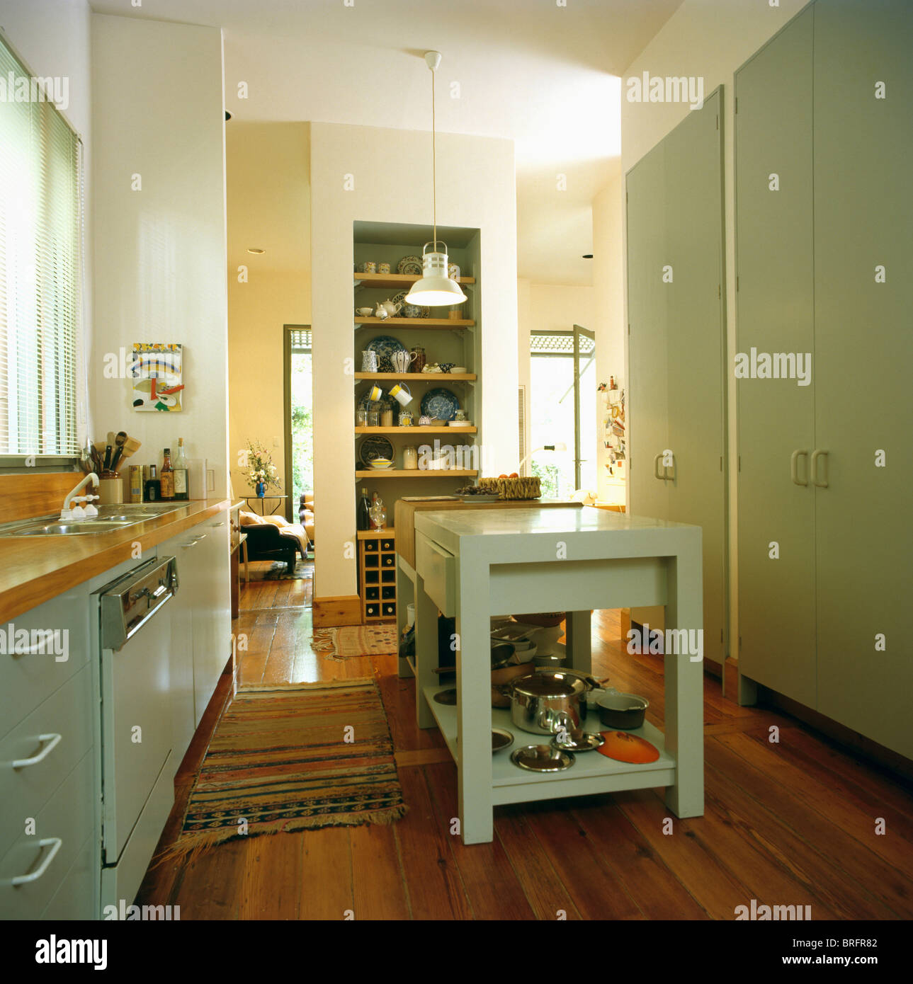 Food preparation table in modern open-plan kitchen with large fitted ...