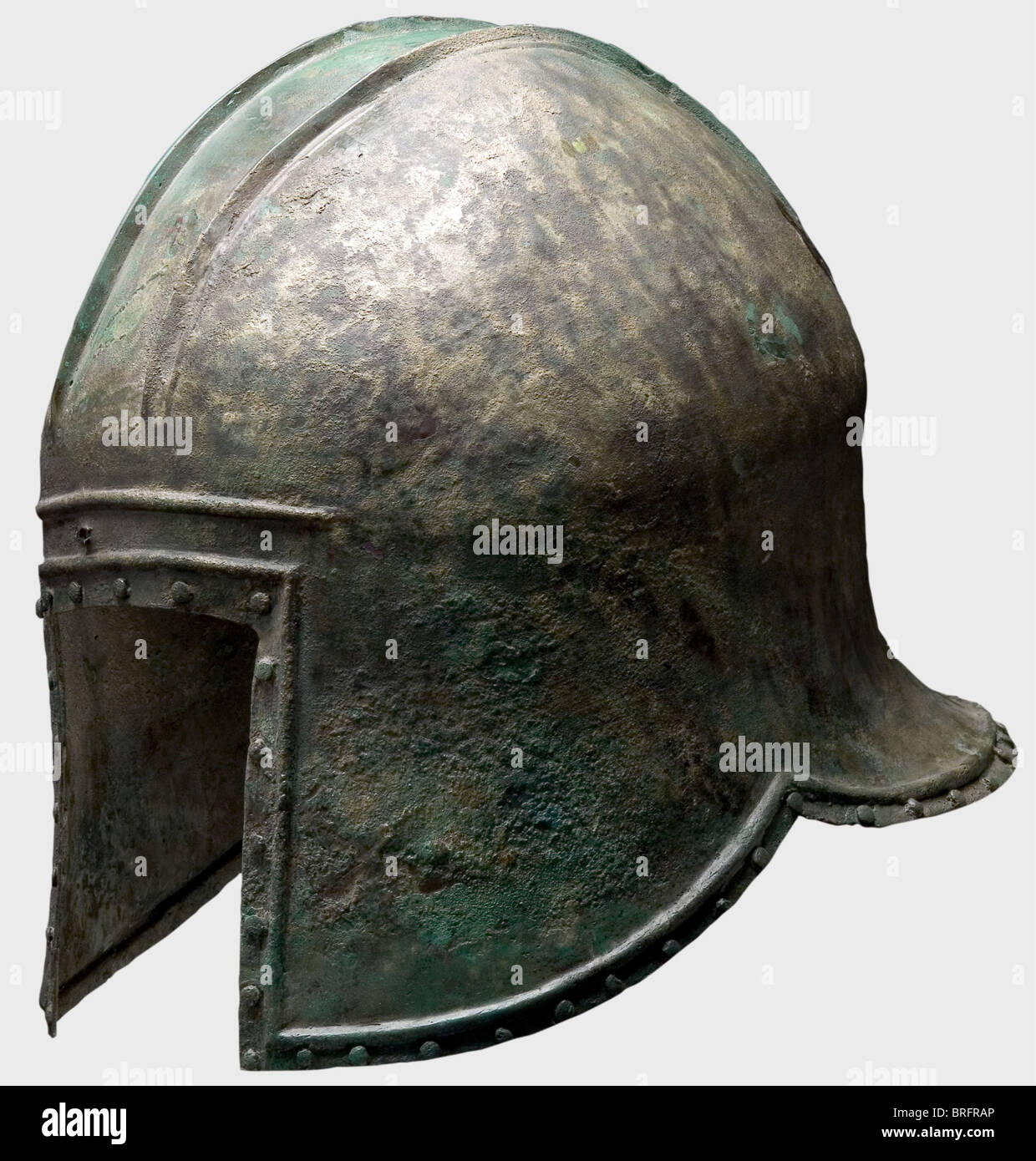 An Illyrian helmet,6th century B.C.Bronze.Domed skull with a broad ...
