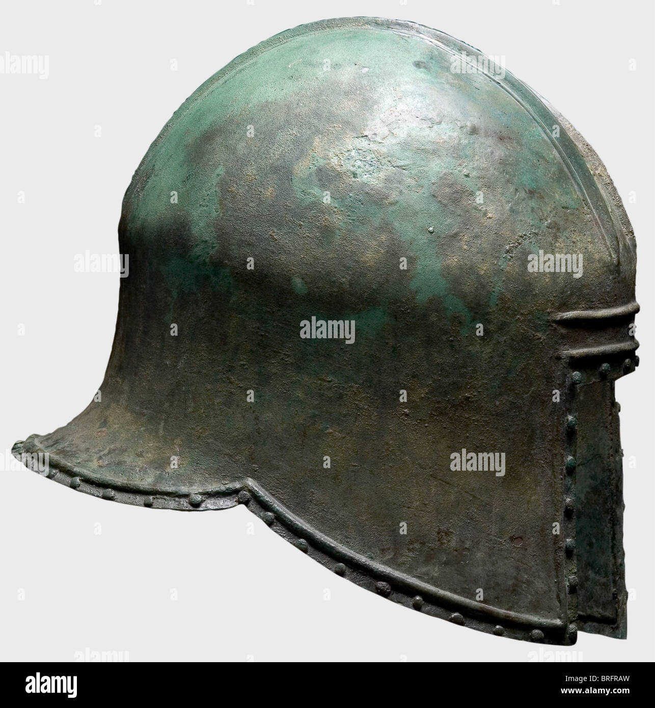 An Illyrian helmet,6th century B.C.Bronze.Domed skull with a broad ...