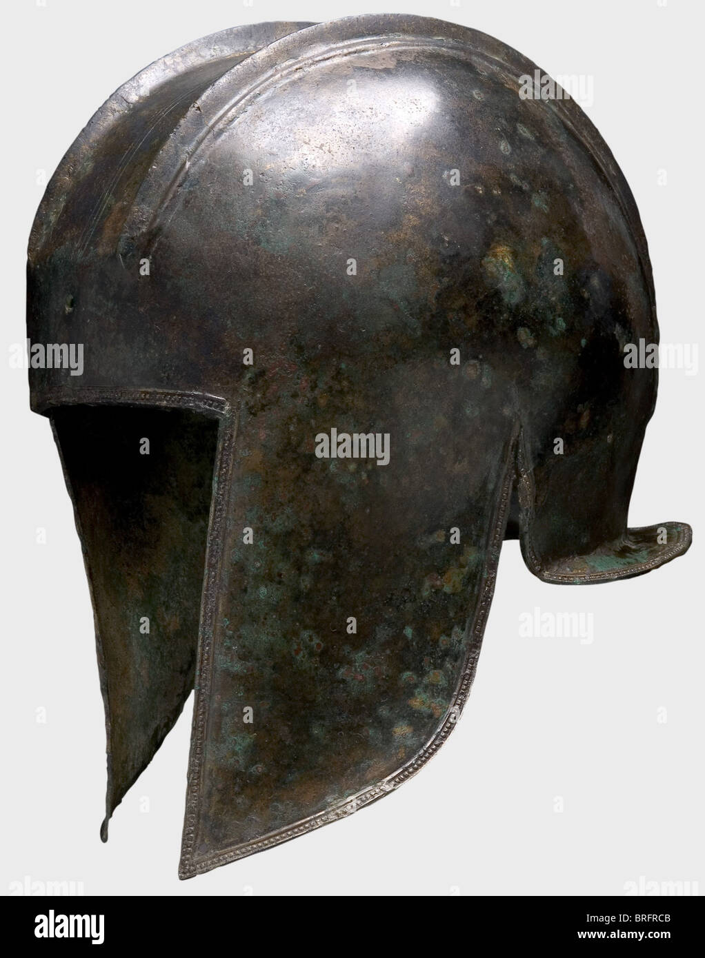 An Illyrian helmet,5th century B.C.Hemispherical,heavy skull with a ...