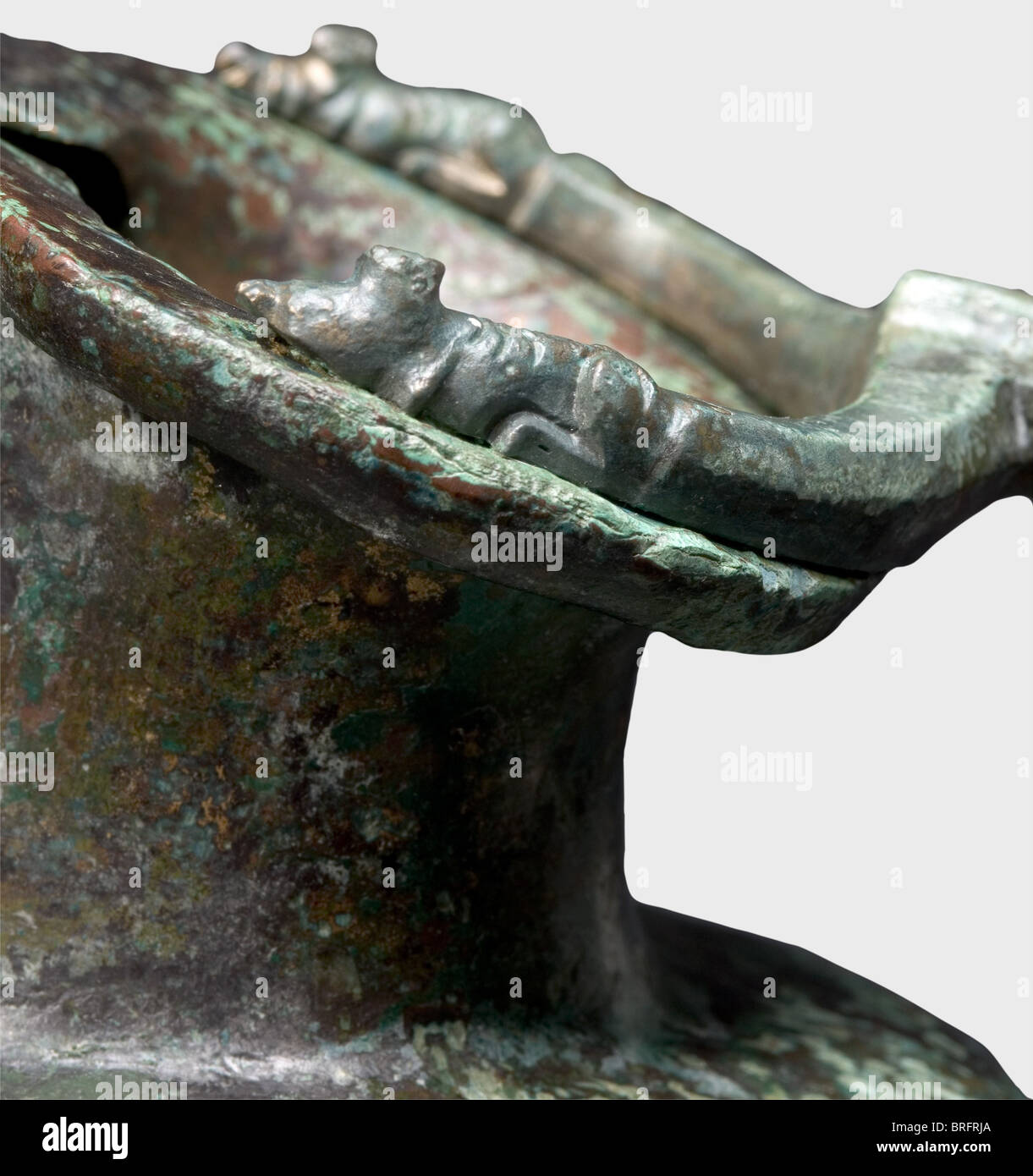 An Etruscan beak-spouted jug, 5th century B.C. Bronze with a heavy ...