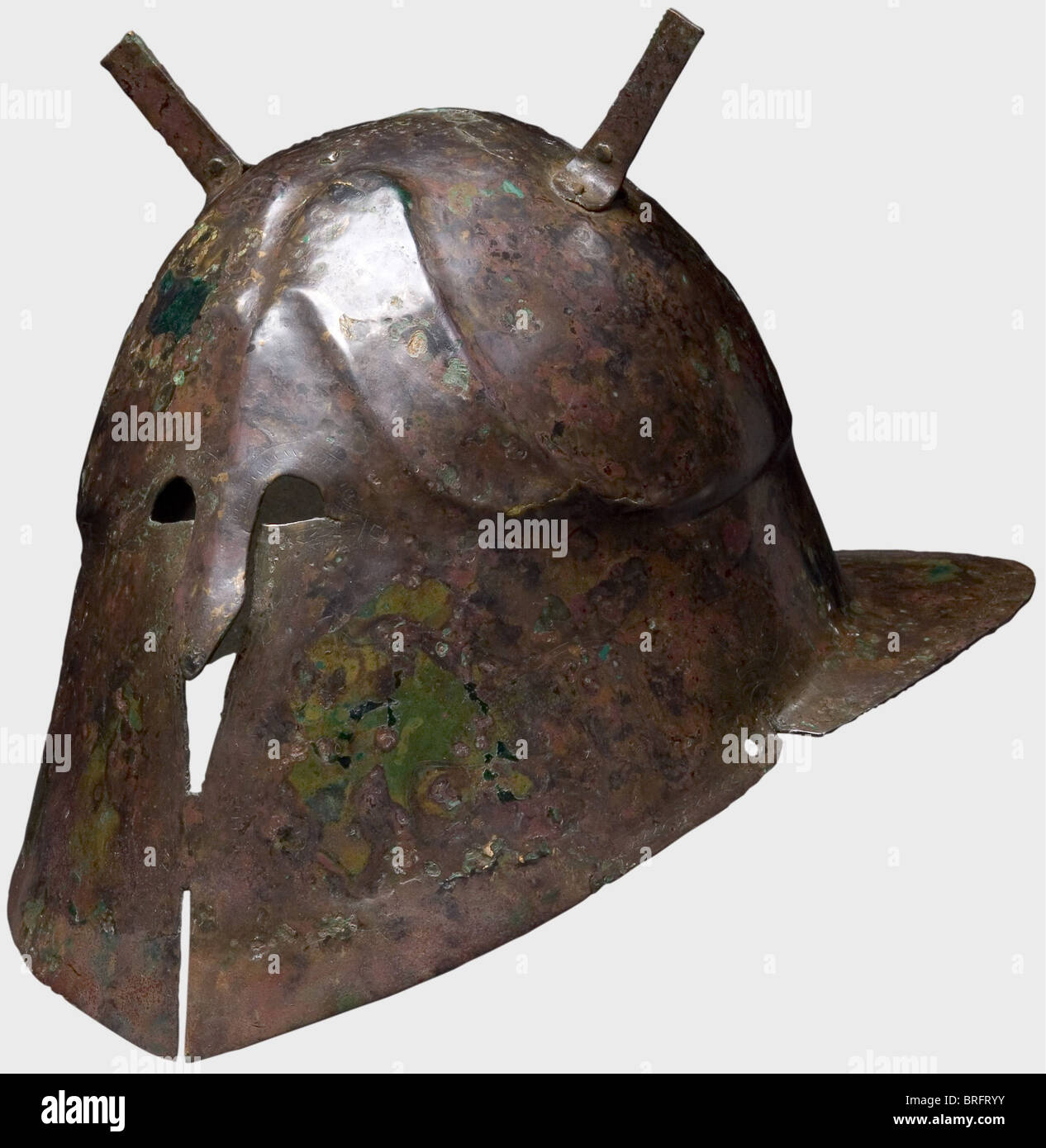 An Apulian-Corinthian helmet,5th century B.C.A heavy,extended bronze ...