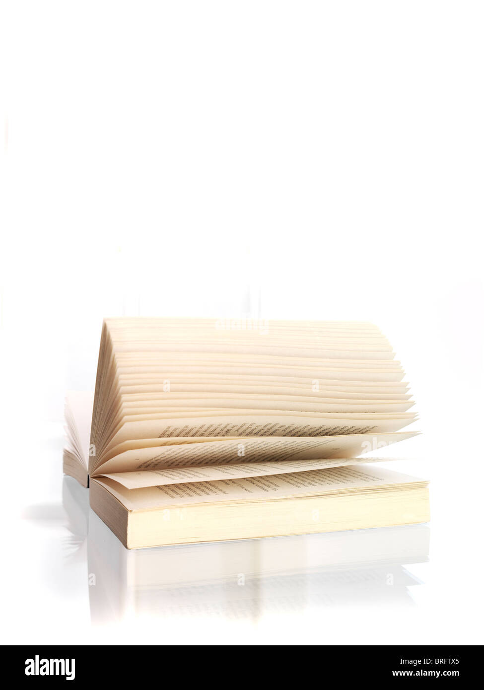 open book on glass table Stock Photo - Alamy