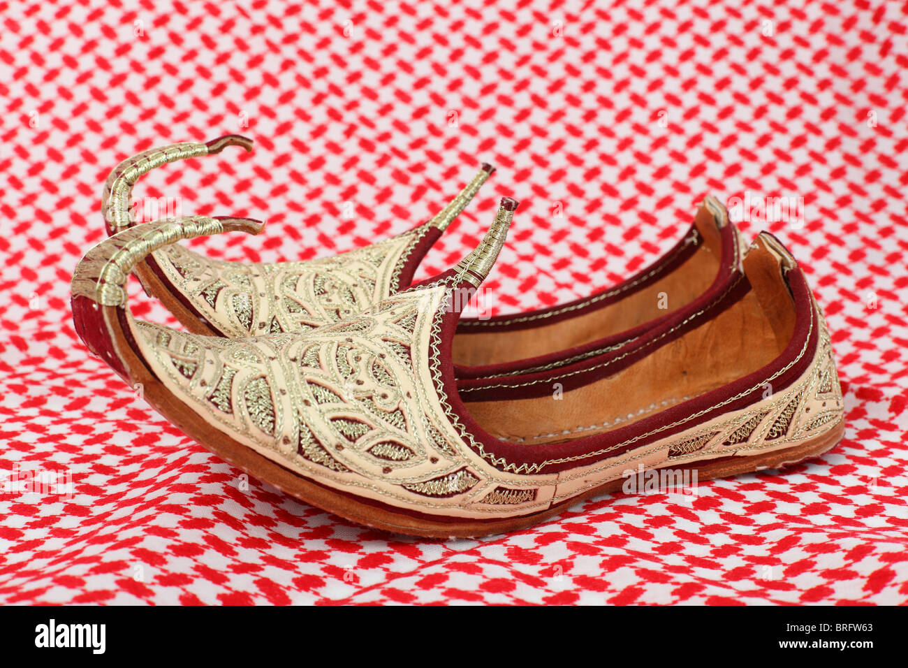 Traditional oriental shoes over arabic cloth Stock Photo - Alamy