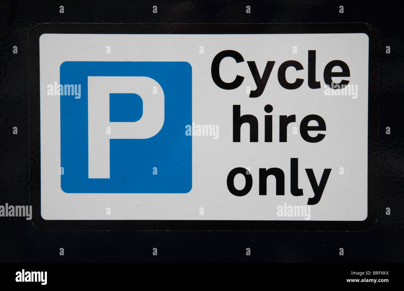 A "Cycle Hire Only" parking sign beside the Barclays Cycle Hire bicycle ...