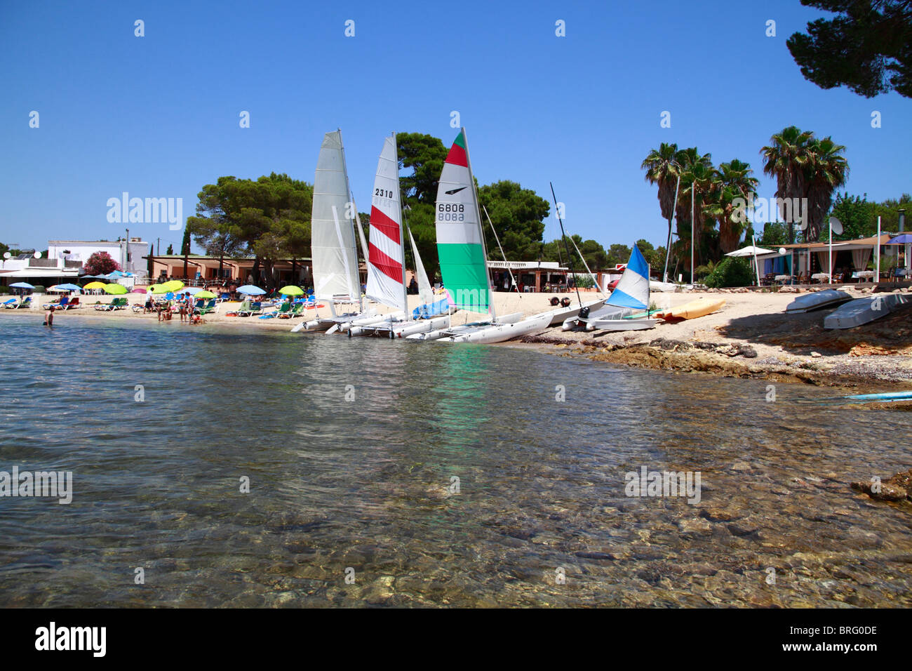 Light sailing boats at Cala Pada beach, general view, Ibiza, Spain ...