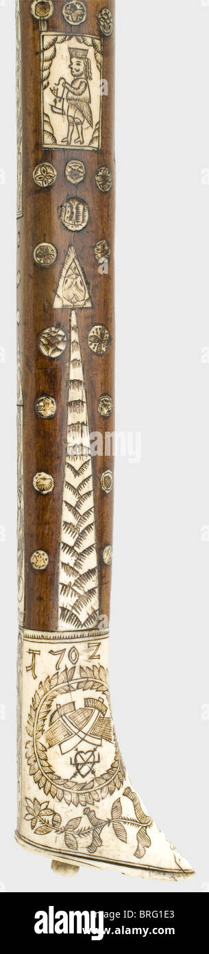 A Saxon miner's axe,dated 1702. Openwork,iron blade. The blade point ...