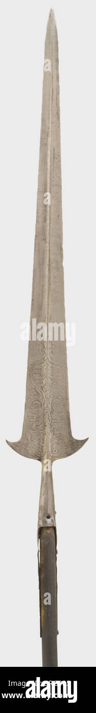 An etched Italian partisan, 16th century. Long double-edged blade with ...