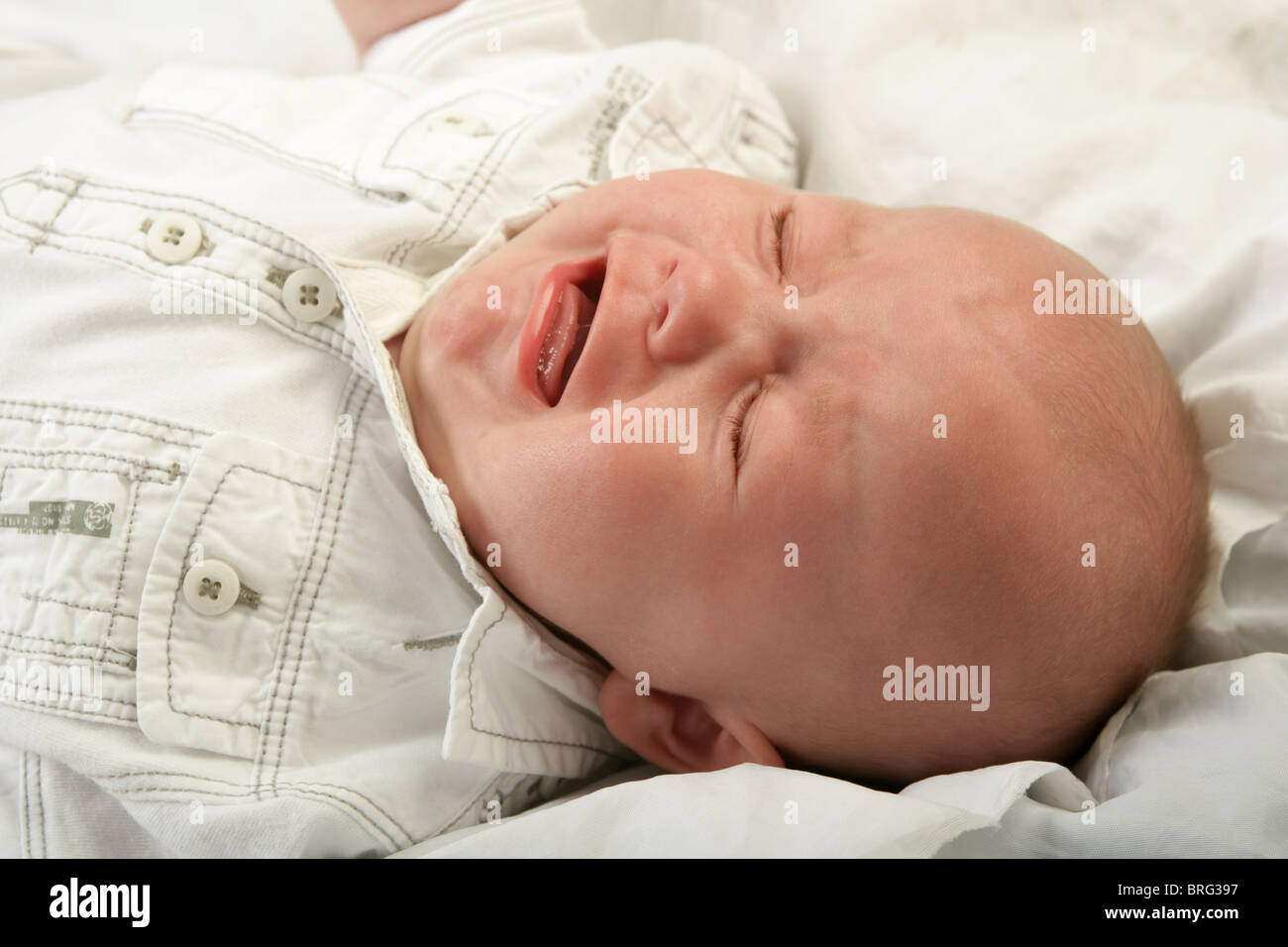 Three month old baby boy crying with his eyes closed Stock Photo - Alamy