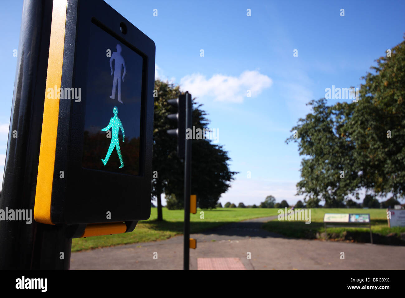 Green man lit up on at pelican pedestrian crossing Stock Photo - Alamy