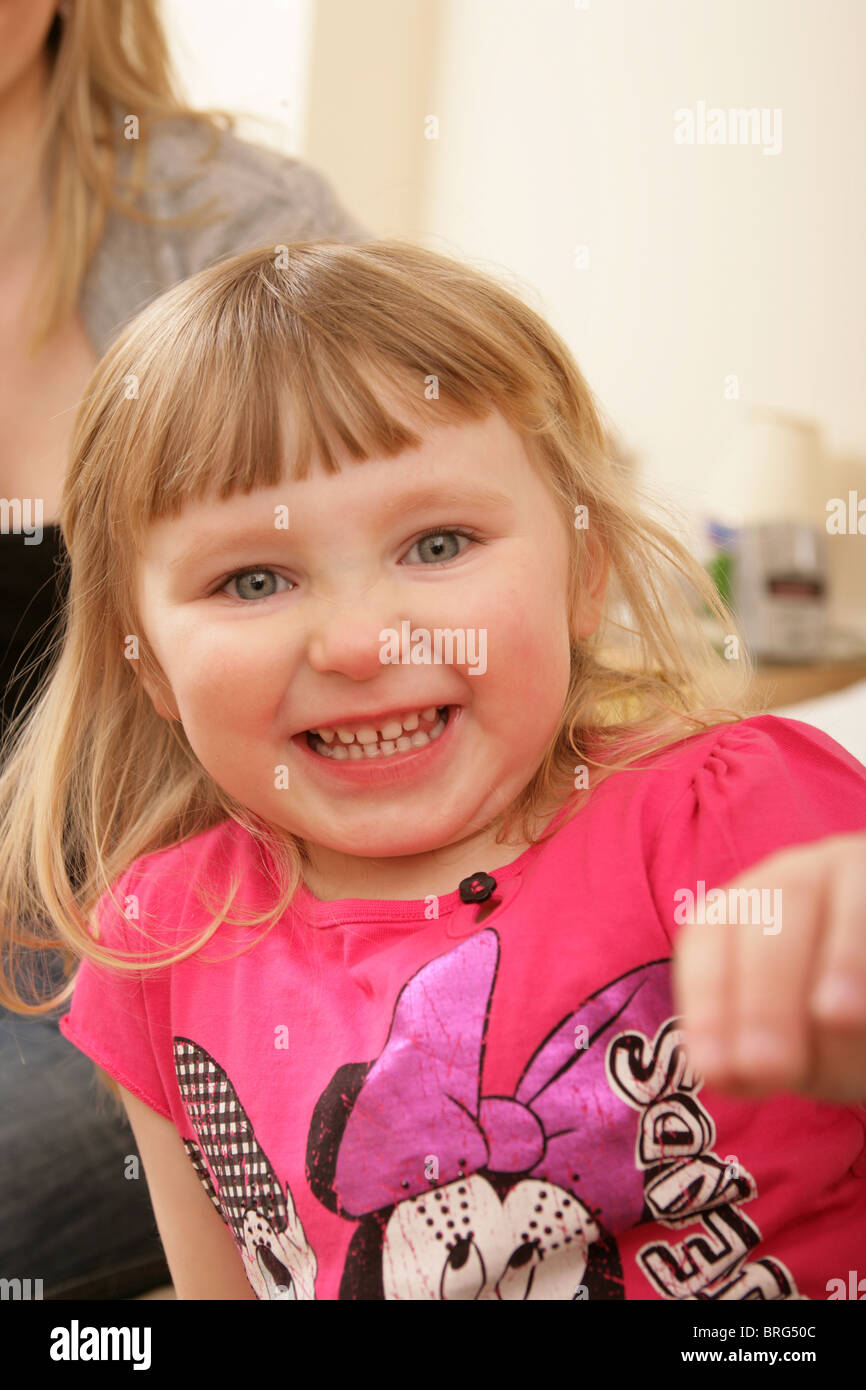 Cute three year old child smiling towards the camera Stock Photo - Alamy