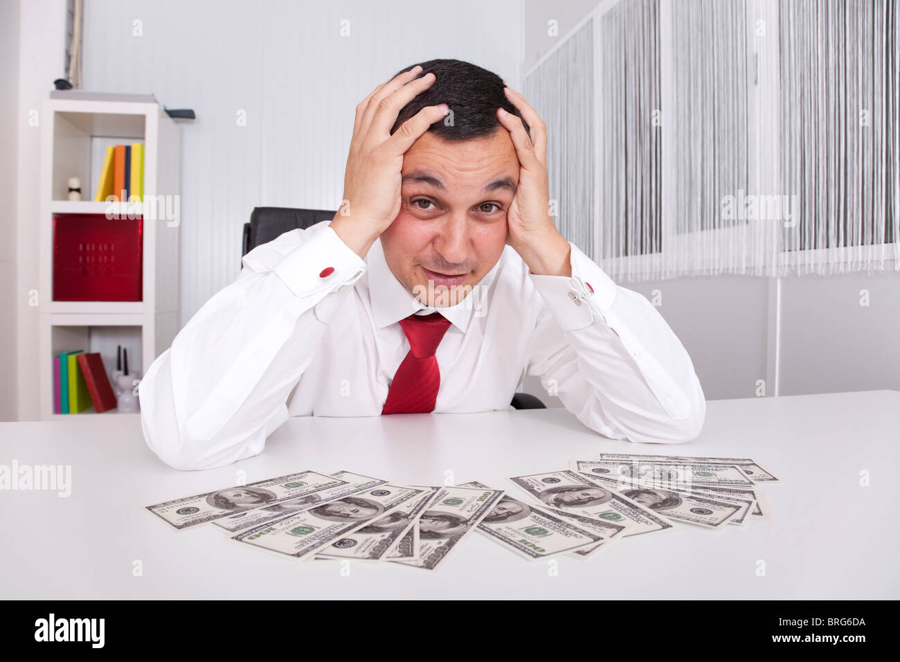 Businessman at the office enjoying his money Stock Photo - Alamy