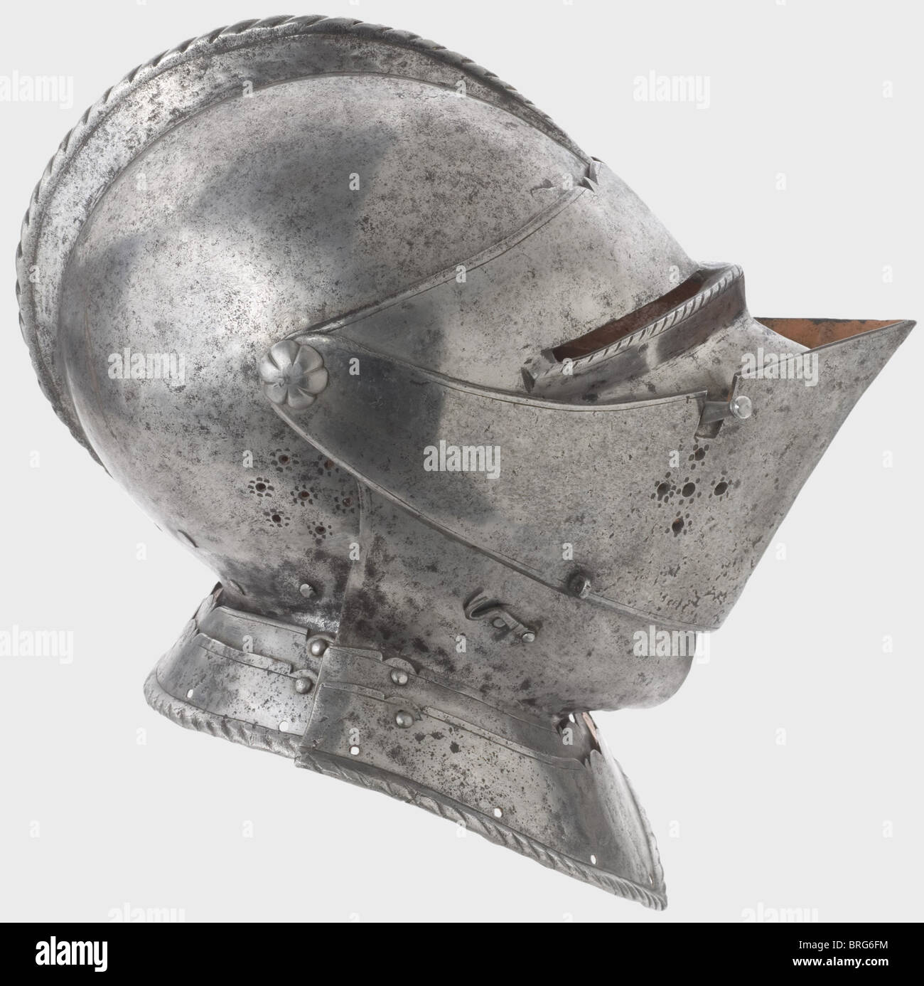 A Flemish or Italian close helmet,circa 1550/60 Skull forged in one ...