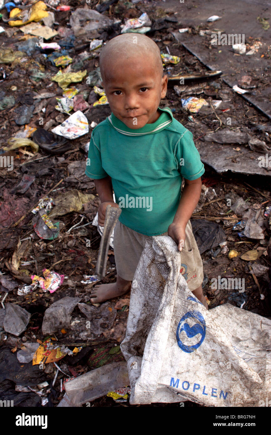 A young child laborer who works at The Stung Meanchey Landfill searches ...