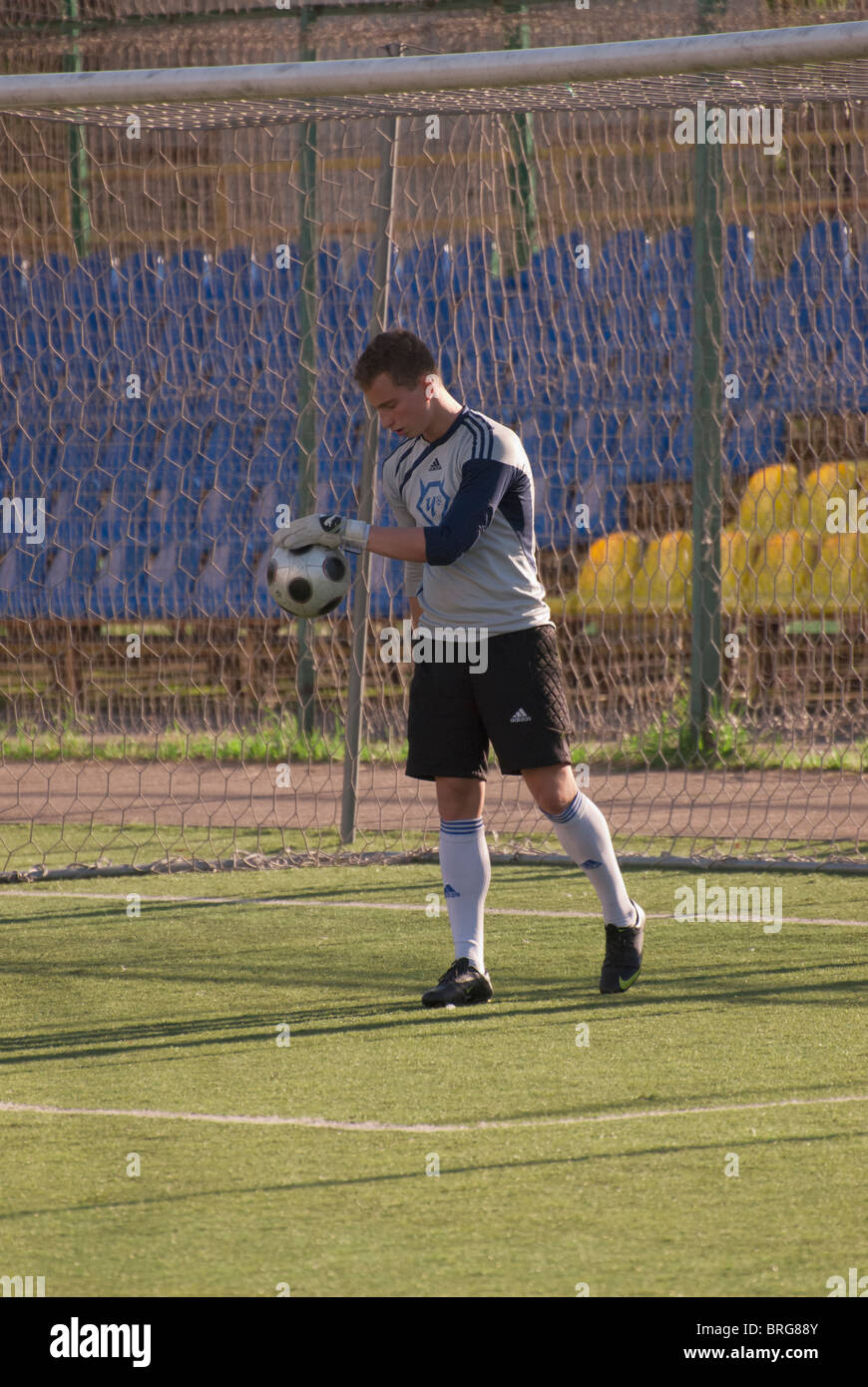 A goalkeeper with the ball Stock Photo - Alamy