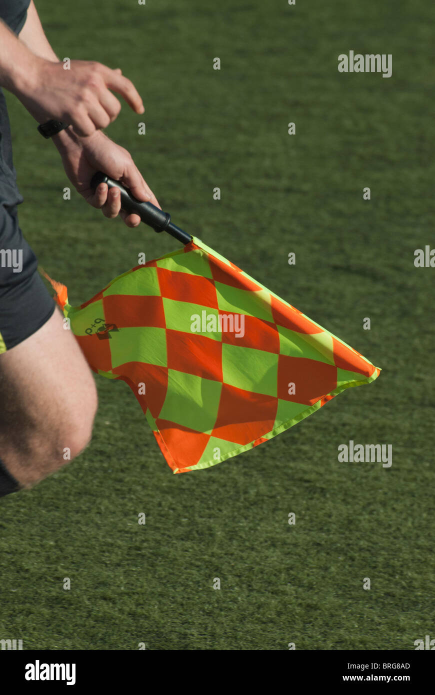 Side referee running along of the pitch border Stock Photo - Alamy