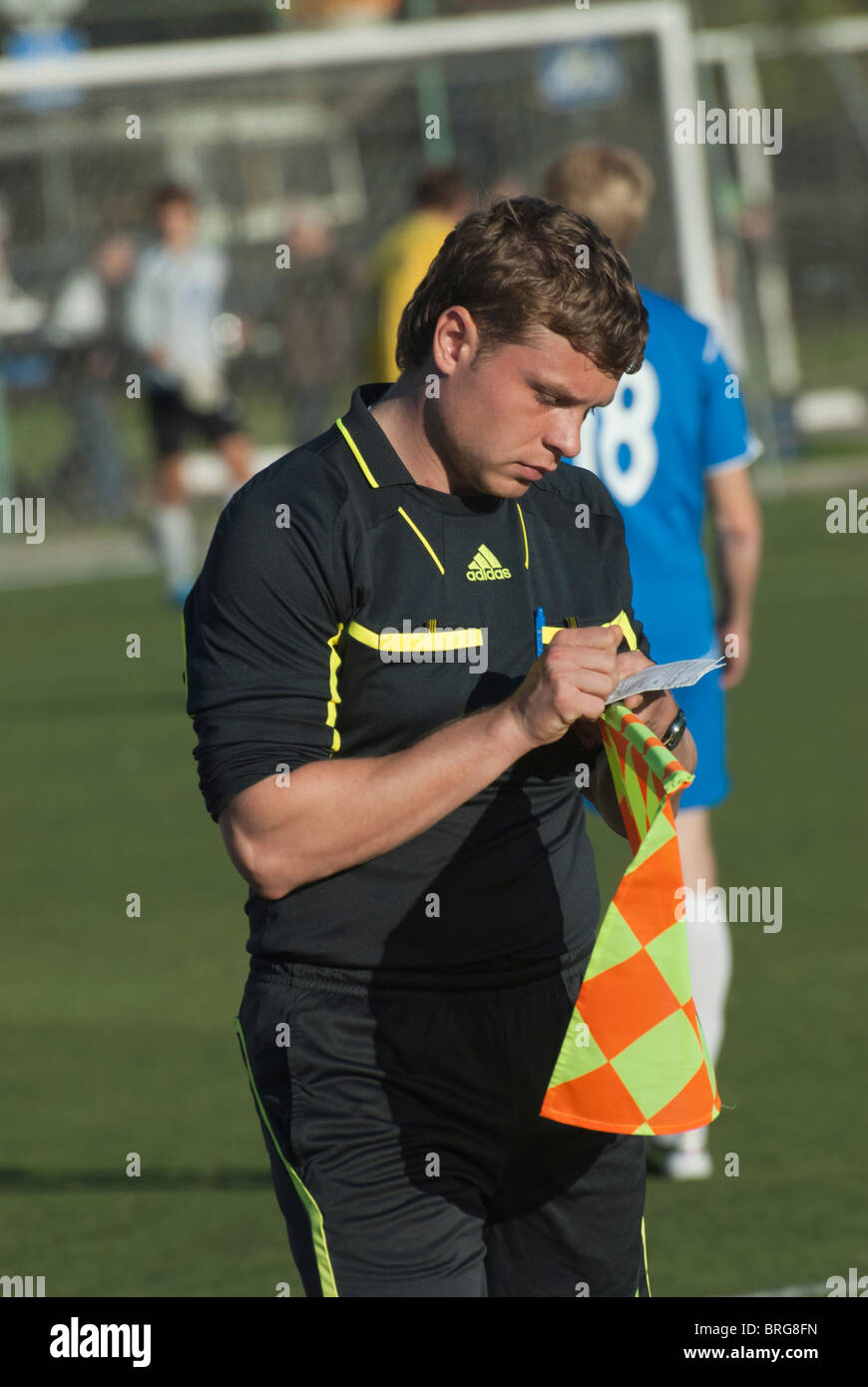 Side referee making note during the football match Stock Photo - Alamy