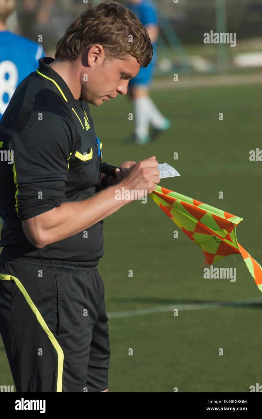 Side referee making note during the football match Stock Photo - Alamy