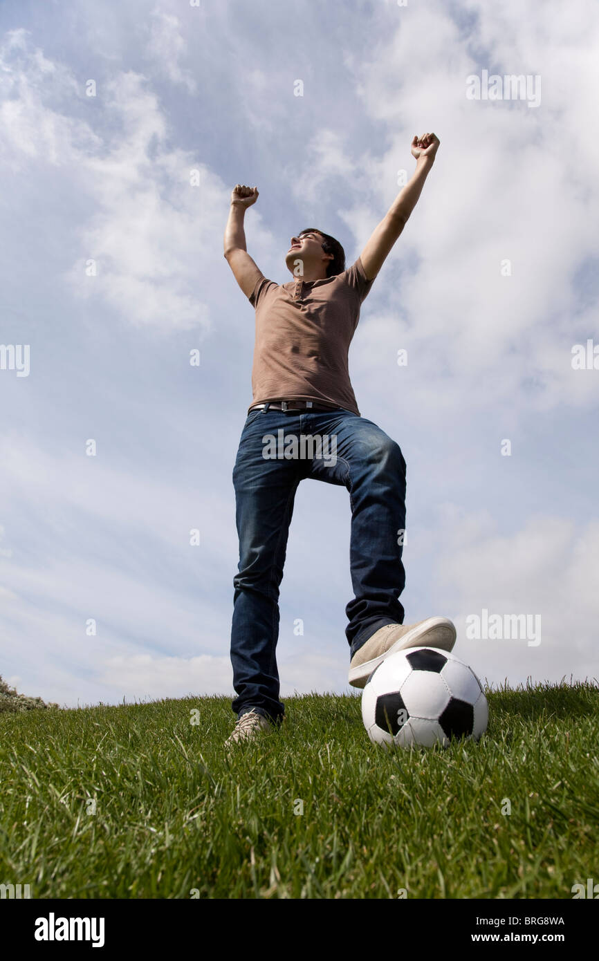 Young men celebrating a soccer goal Stock Photo - Alamy