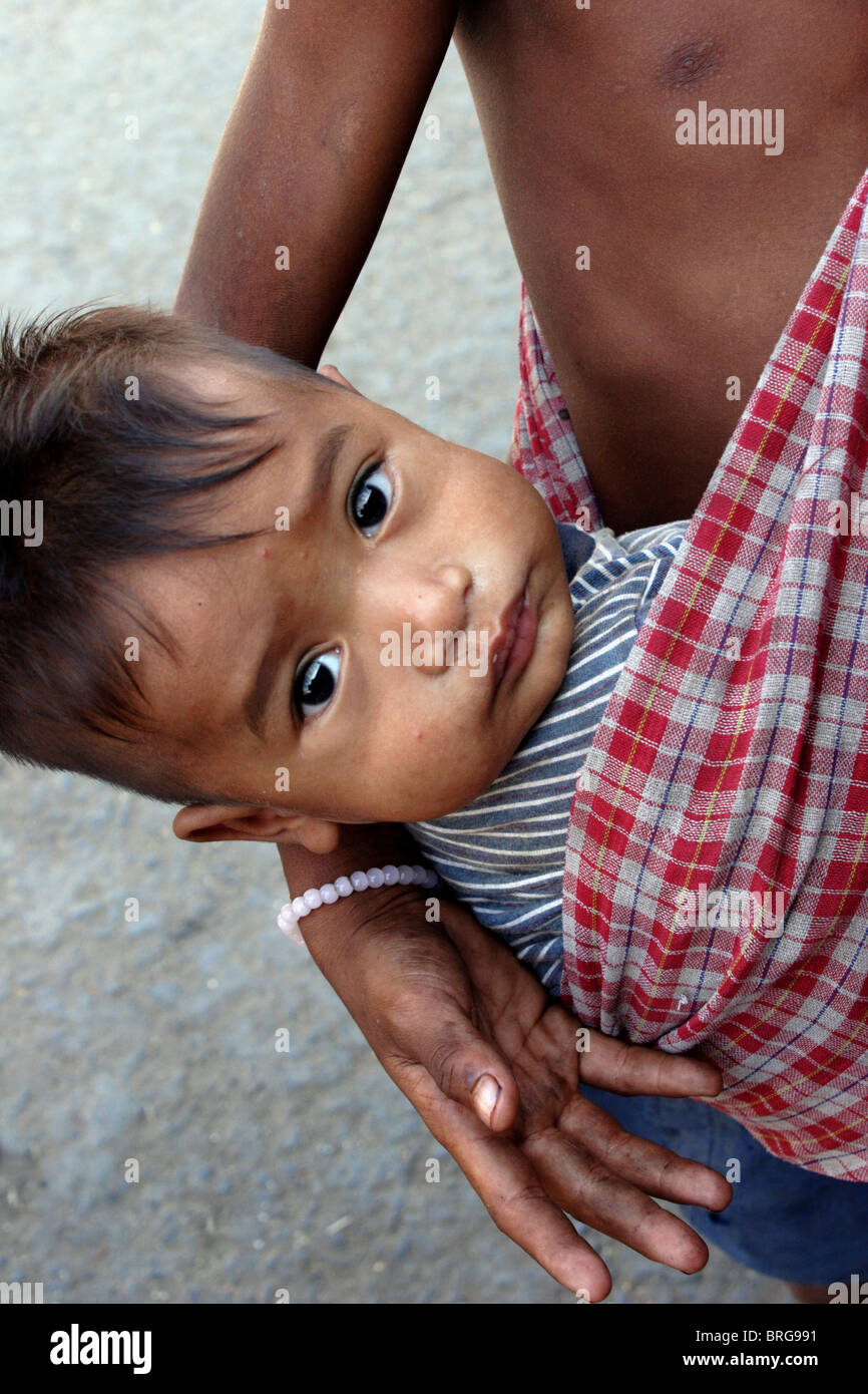 Two hungry boys are in need of food on the streets of Kampong, Cham ...