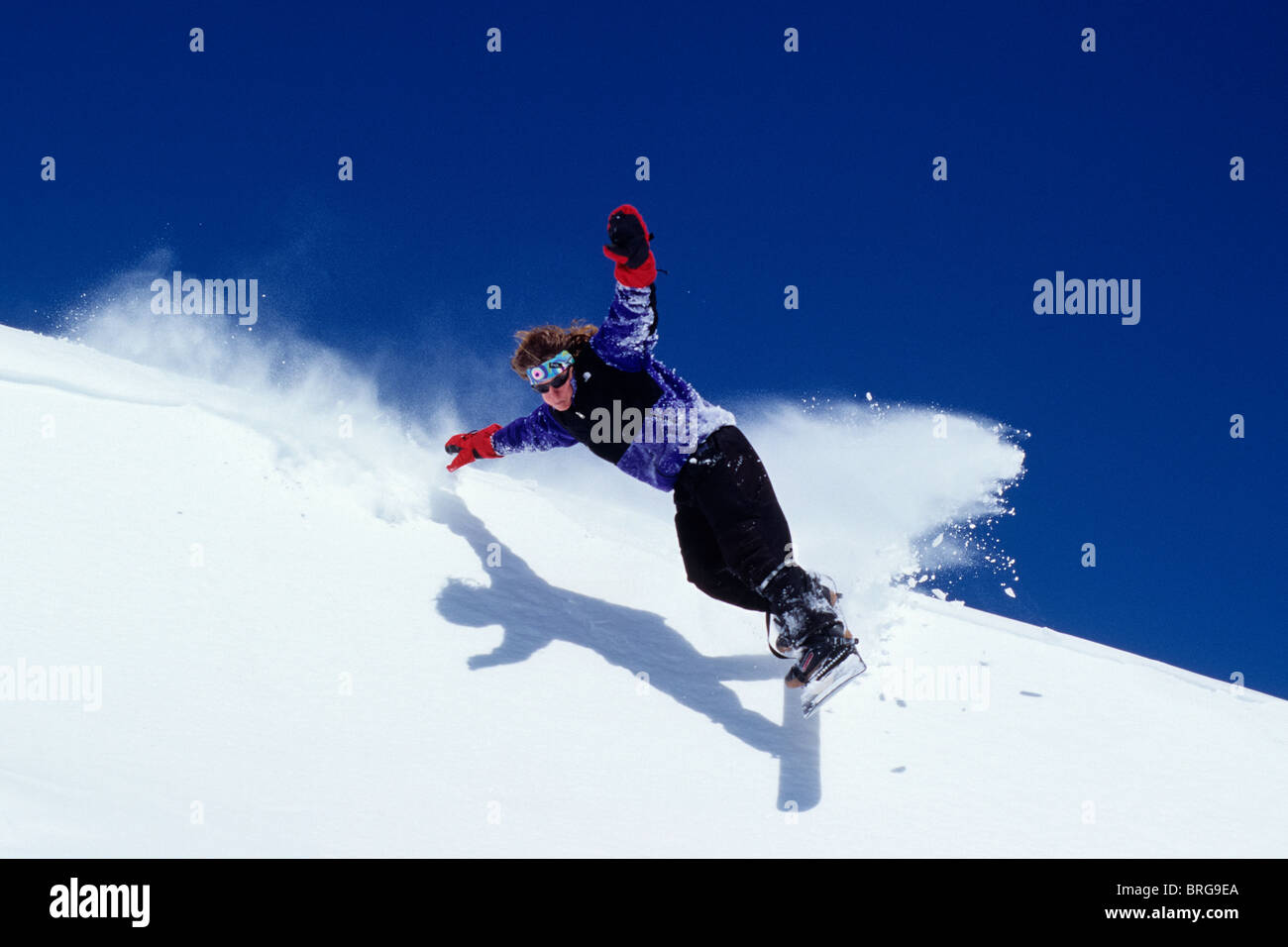 Young male snowboarder in action Stock Photo - Alamy